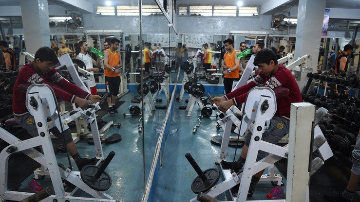 Young men take to bodybuilding gyms in war-torn Kabul