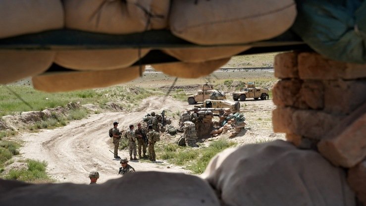 Afghan army starts closing checkpoints, building larger bases